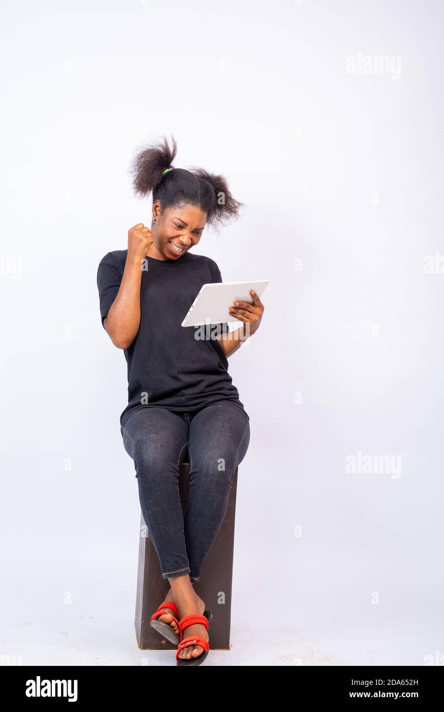 Lady using a tablet computer hi-res stock photography and images - Alamy