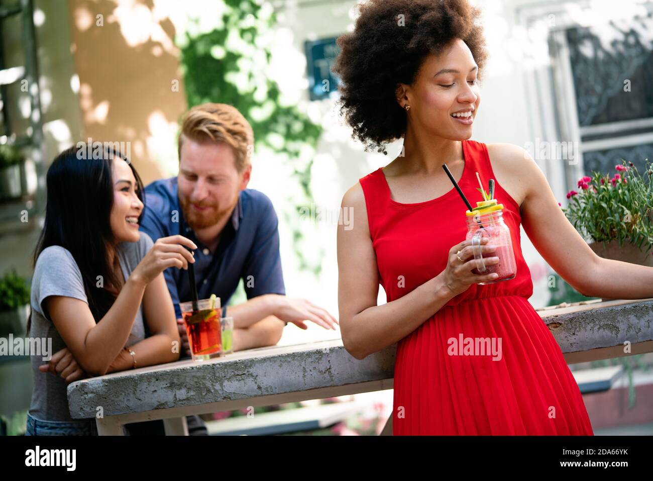 Young friends having a great time together. Group of people talking and ...