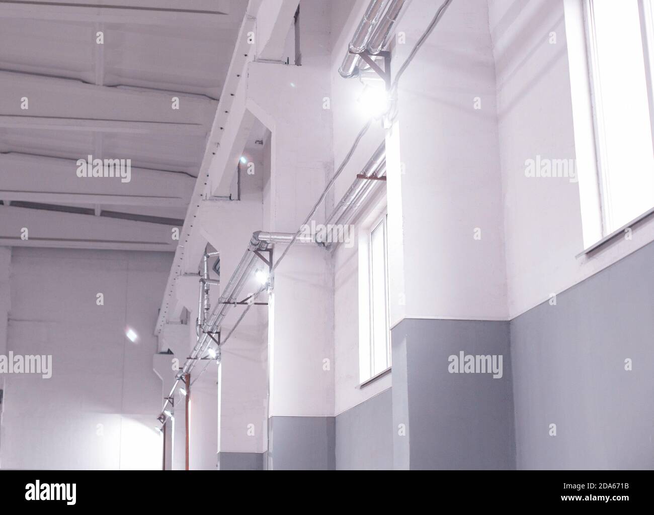 Lighting with modern LED floodlights in the production room for storing ...