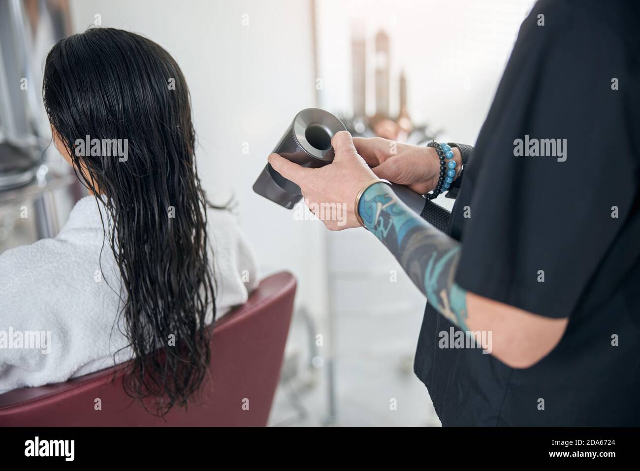 Stylist fixing hairstyle hi-res stock photography and images - Alamy