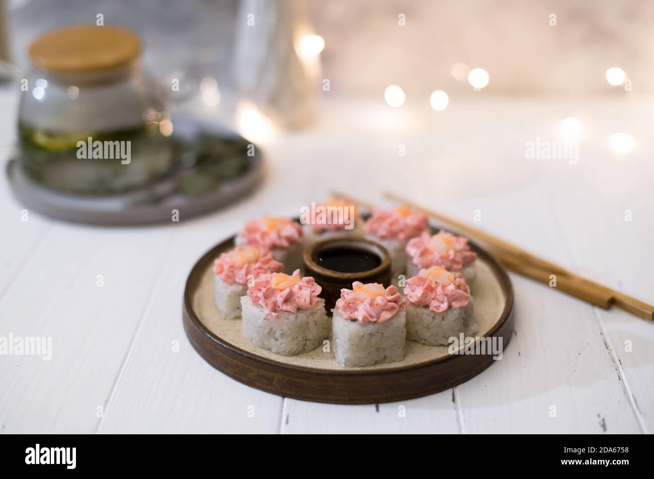 Lava Roll with cream cheese on white wooden background with garland ...