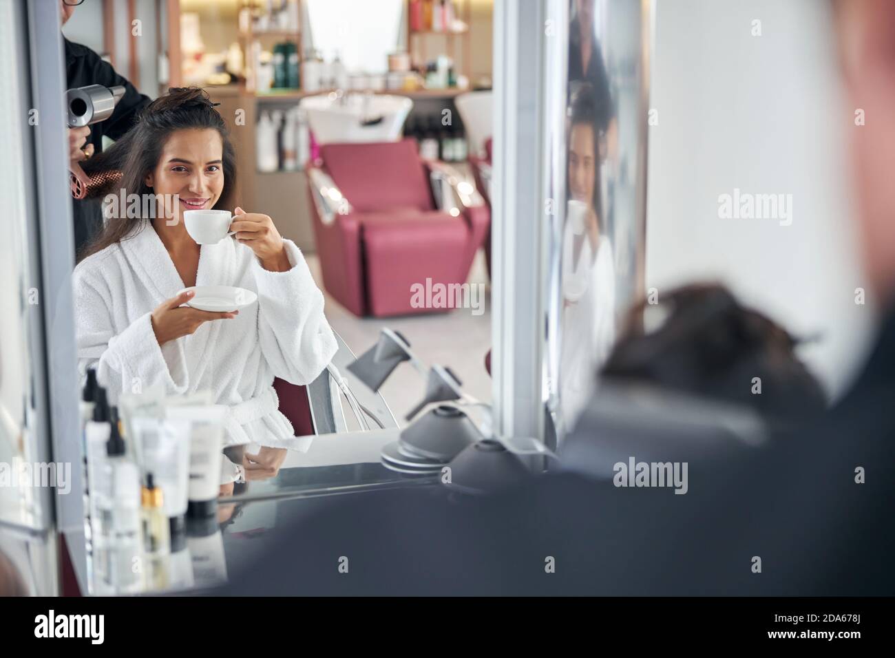 Client taking a sip of a tasty drink Stock Photo - Alamy