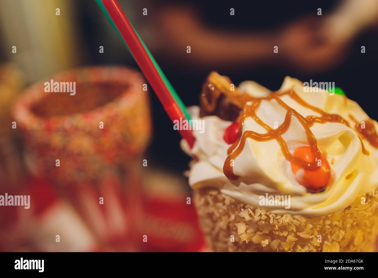 Glasses of milkshake, frappe, ice coffee and smoothie with whipped ...