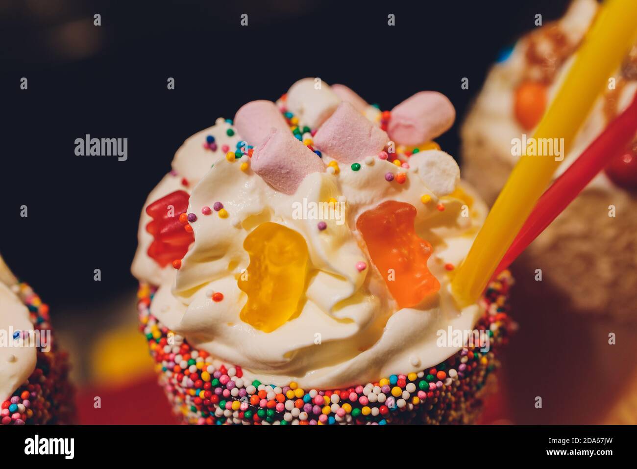 Glasses of milkshake, frappe, ice coffee and smoothie with whipped ...