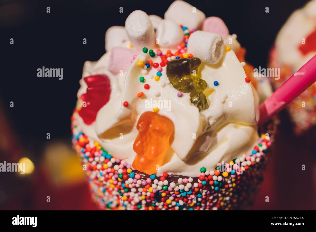 Glasses of milkshake, frappe, ice coffee and smoothie with whipped ...