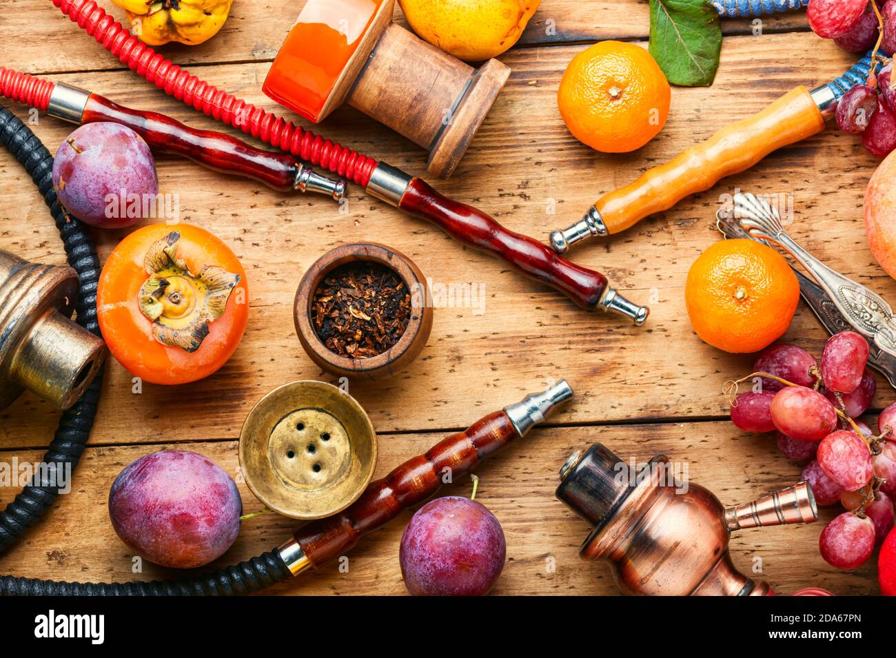 Smoking hookah with fresh fruit aroma.Tobacco fruit shisha.Trendy ...