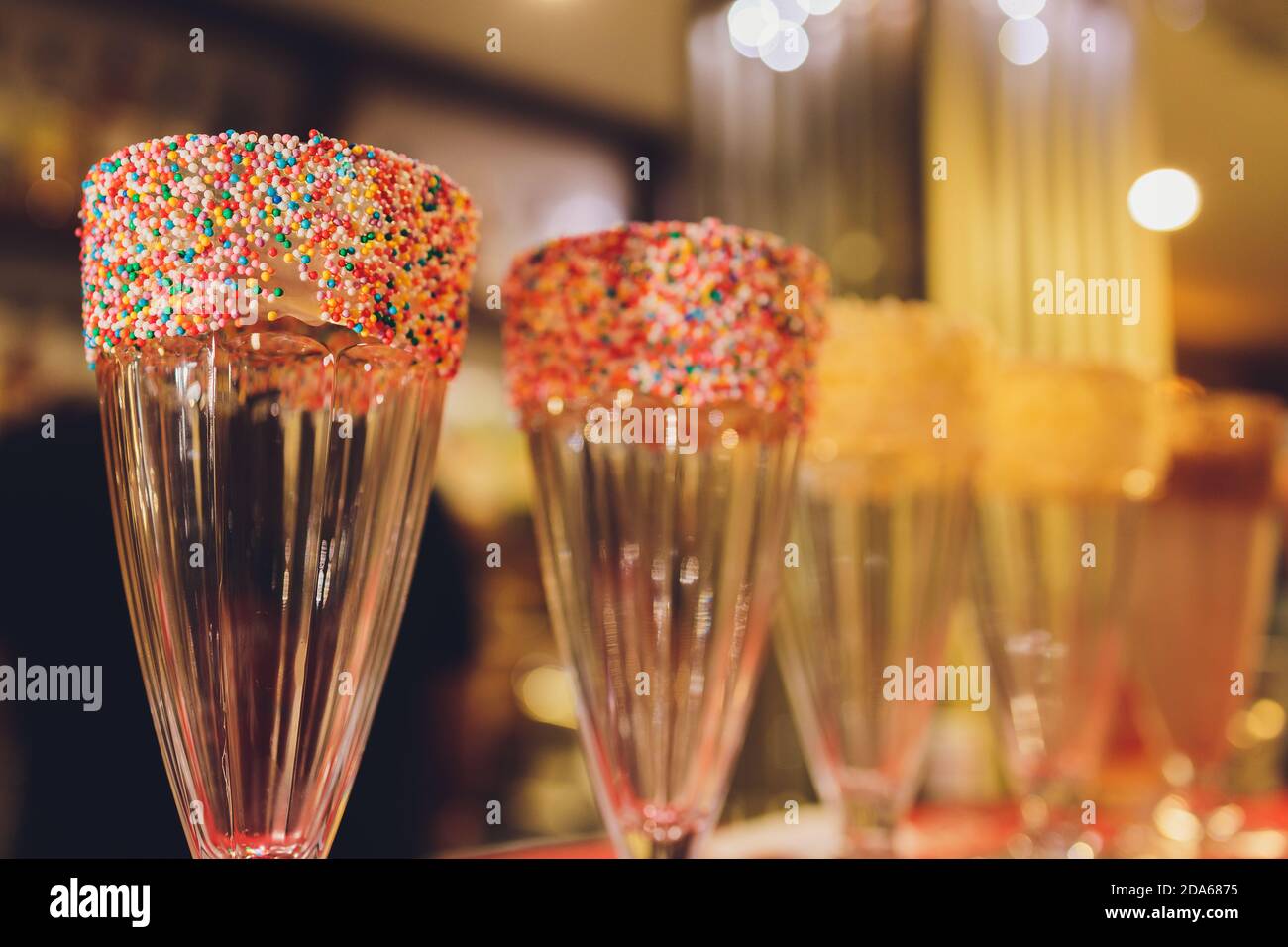 Glasses of milkshake, frappe, ice coffee and smoothie with whipped ...