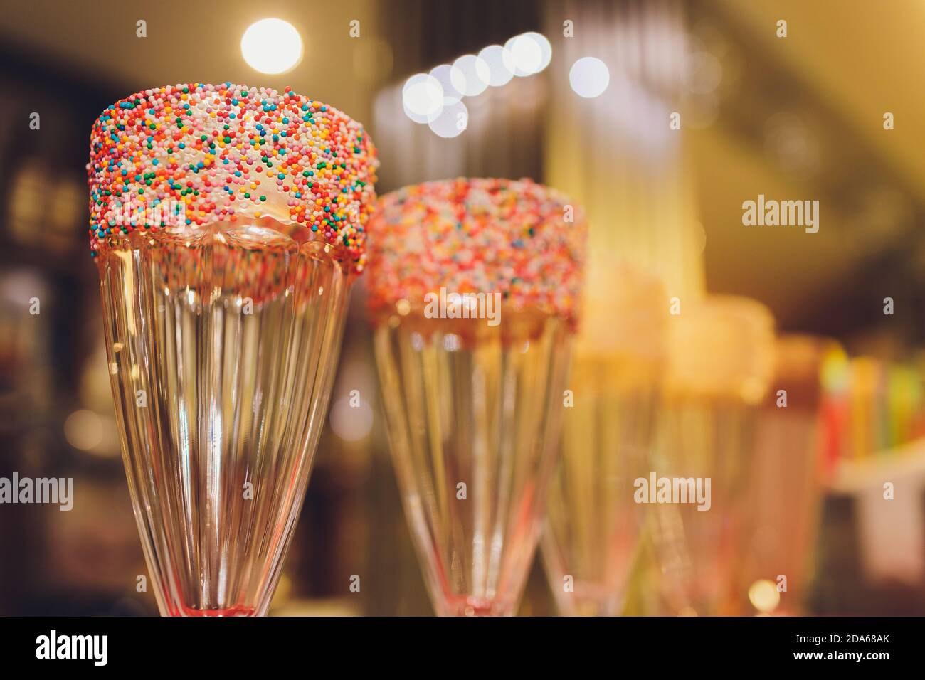 Glasses of milkshake, frappe, ice coffee and smoothie with whipped ...