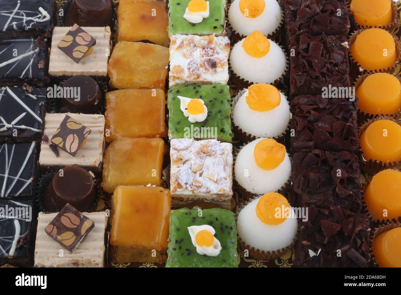 small sweet cakes as delicious dessert Stock Photo - Alamy