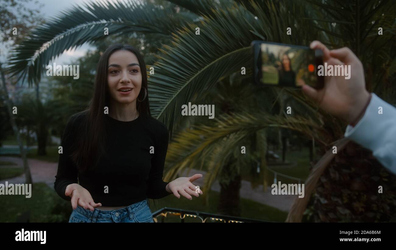 Beautiful smiling fashion blogger woman making online new video blog ...