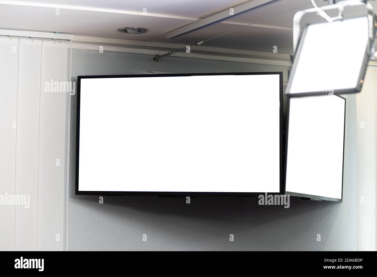 blank screen hanging on the wall Stock Photo - Alamy