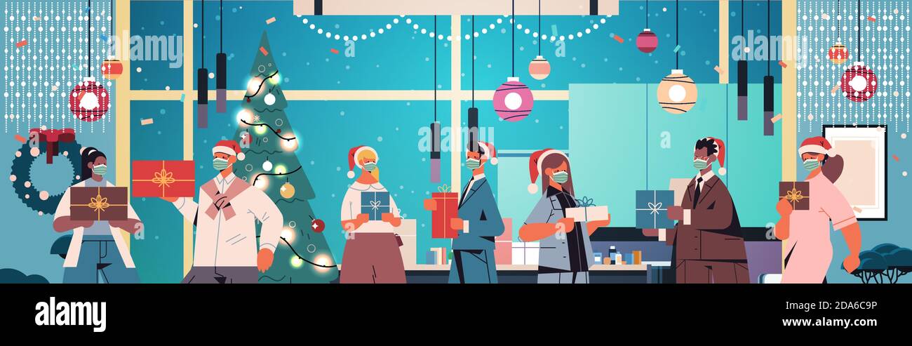 Work colleagues wearing santa claus hats hi-res stock photography and ...