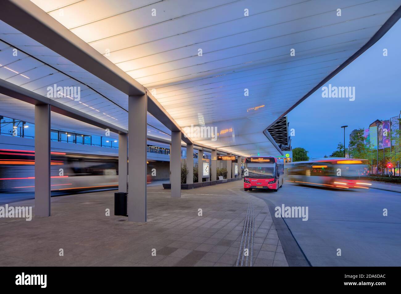 Illuminated new busstion at night. The new Tilburg bus station has a ...