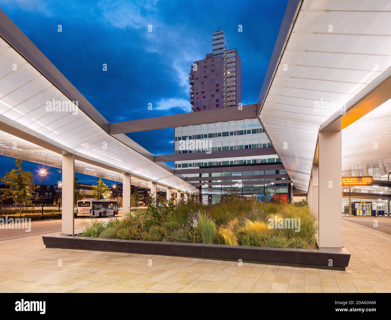 Illuminated new busstion at night. The new Tilburg bus station has a ...