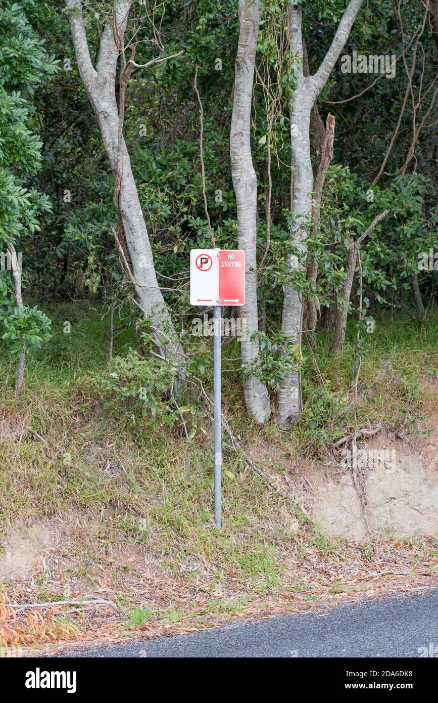A no parking, no standing sign on the edge of the littoral rainforest ...