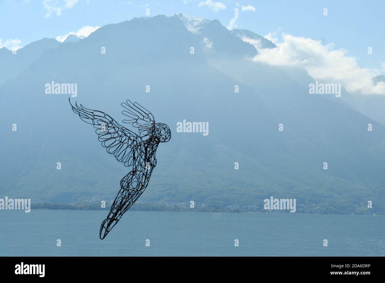 Wire line art angel figurine flying over water through high mountains ...