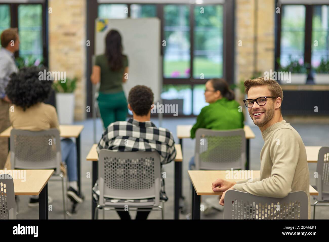 Professional development. Cheerful caucasian man smiling at camera ...