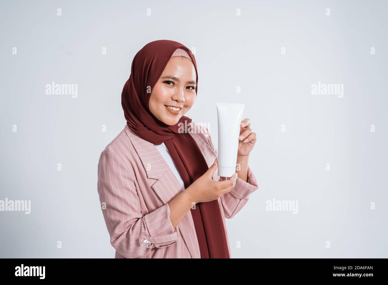 Happy business muslim woman portrait bring cosmetic product on white ...