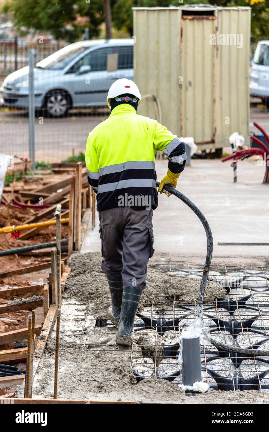 Construction worker using safety rules is working on a reinforced ...
