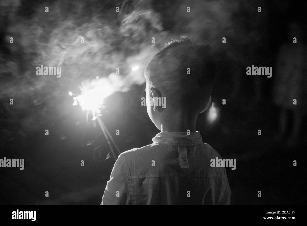A boy holding a firecrackers Stock Photo - Alamy