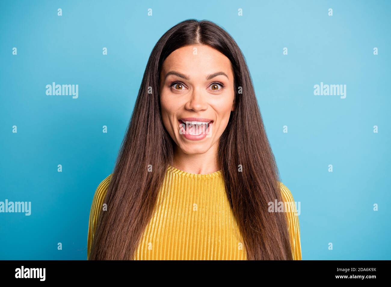 Photo portrait of excited girl with open mouth isolated on pastel blue ...