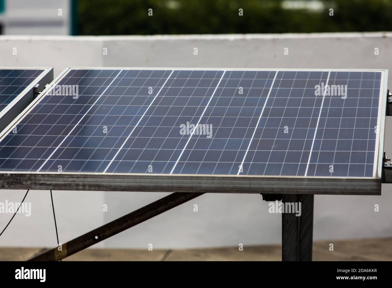 Close up view of solar powered energy panels installed on a rooftop to ...