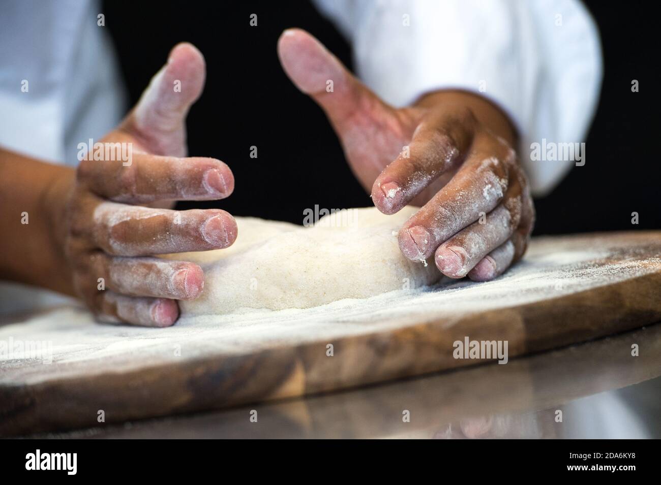 detail of the hands of a pizza chef chef who works for the various ...
