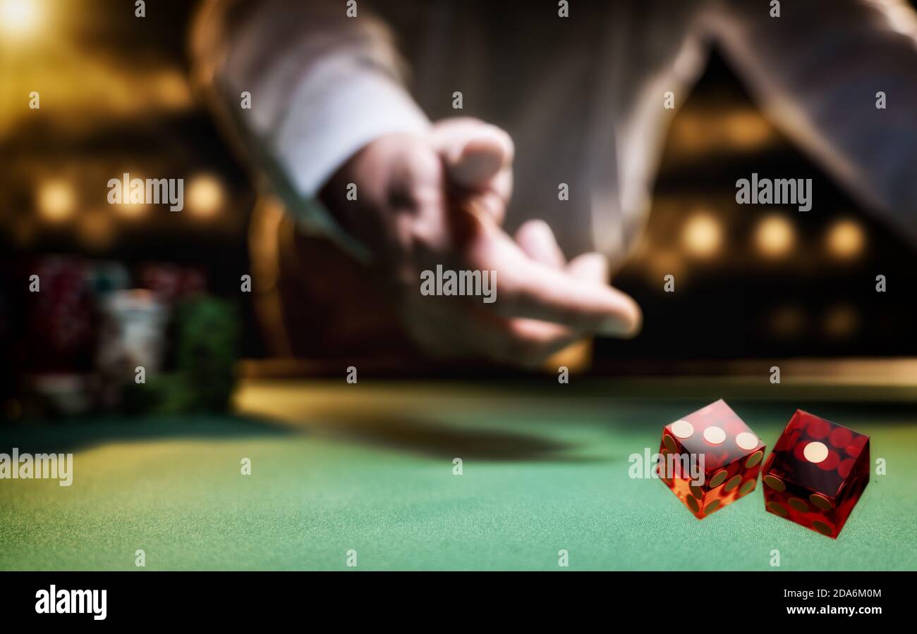Man gambling at the craps table at the casino - Selective focus Stock ...