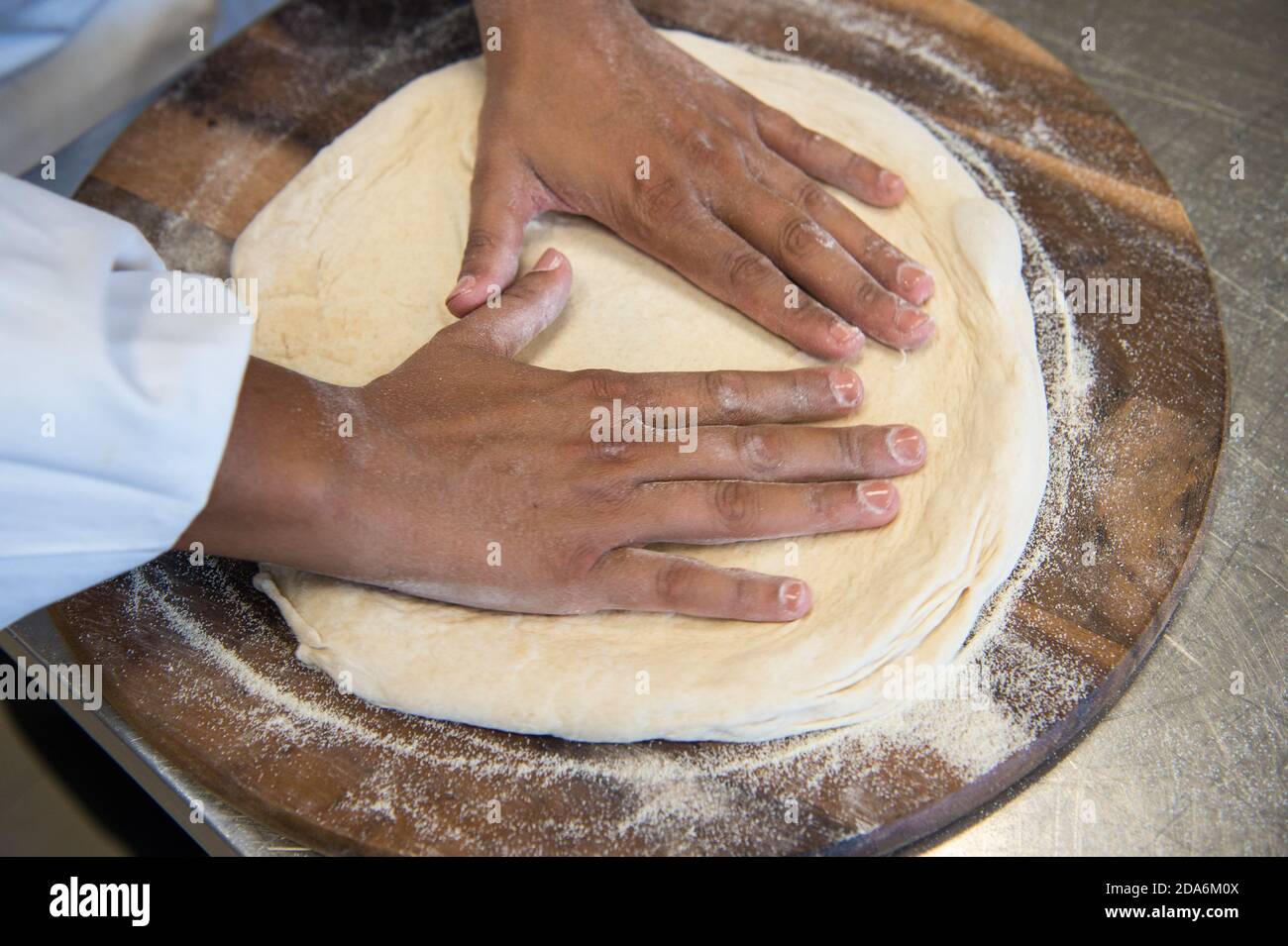 detail of the hands of a pizza chef chef who works for the various ...
