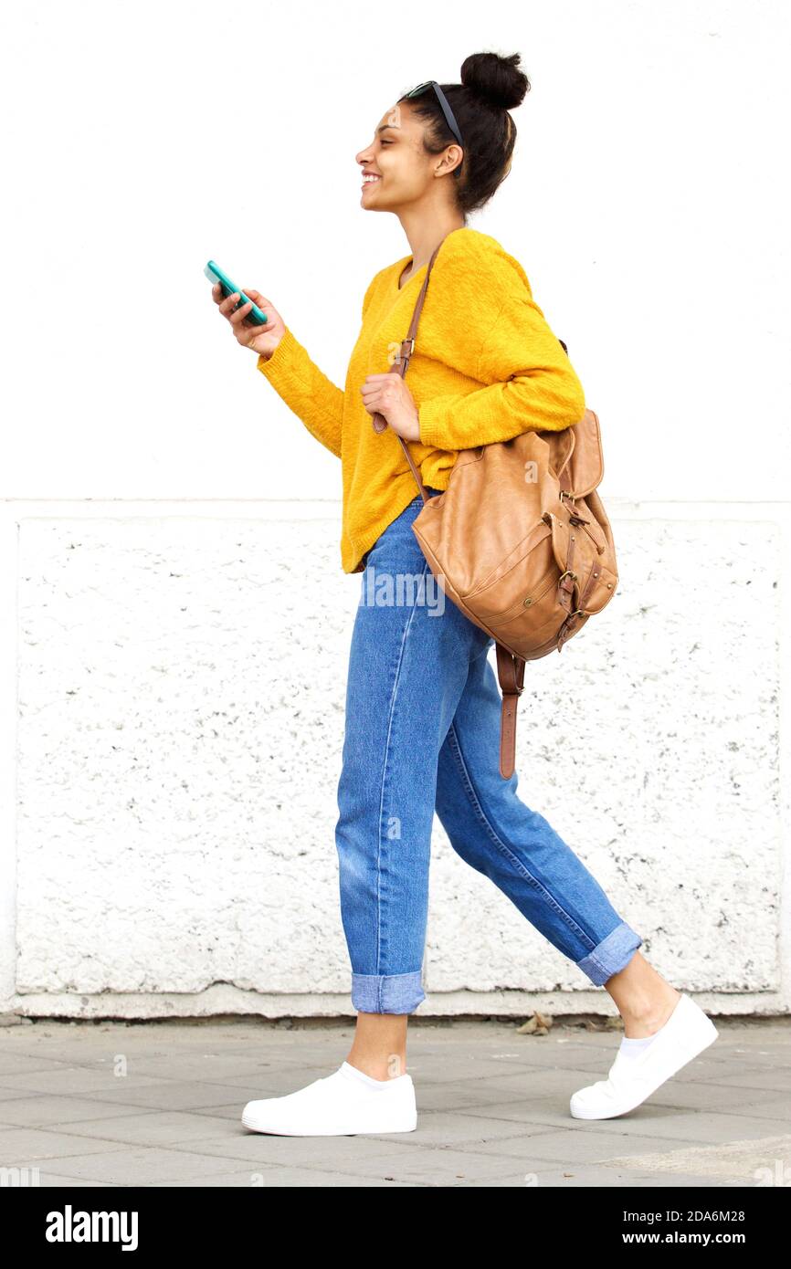 Stylish woman walking side view hi-res stock photography and images - Alamy