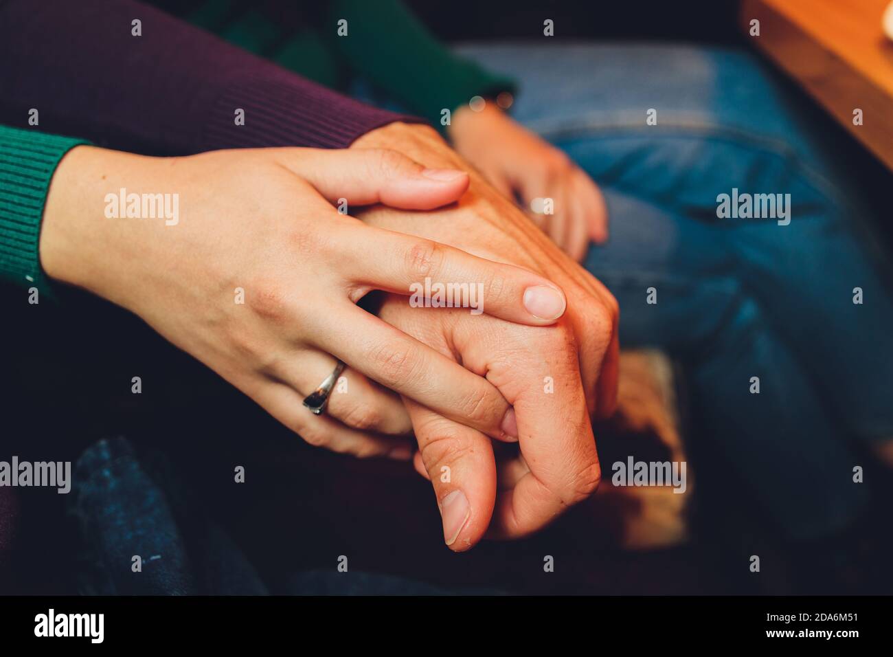 women's and men's watches. man's hand holding a female Stock Photo - Alamy