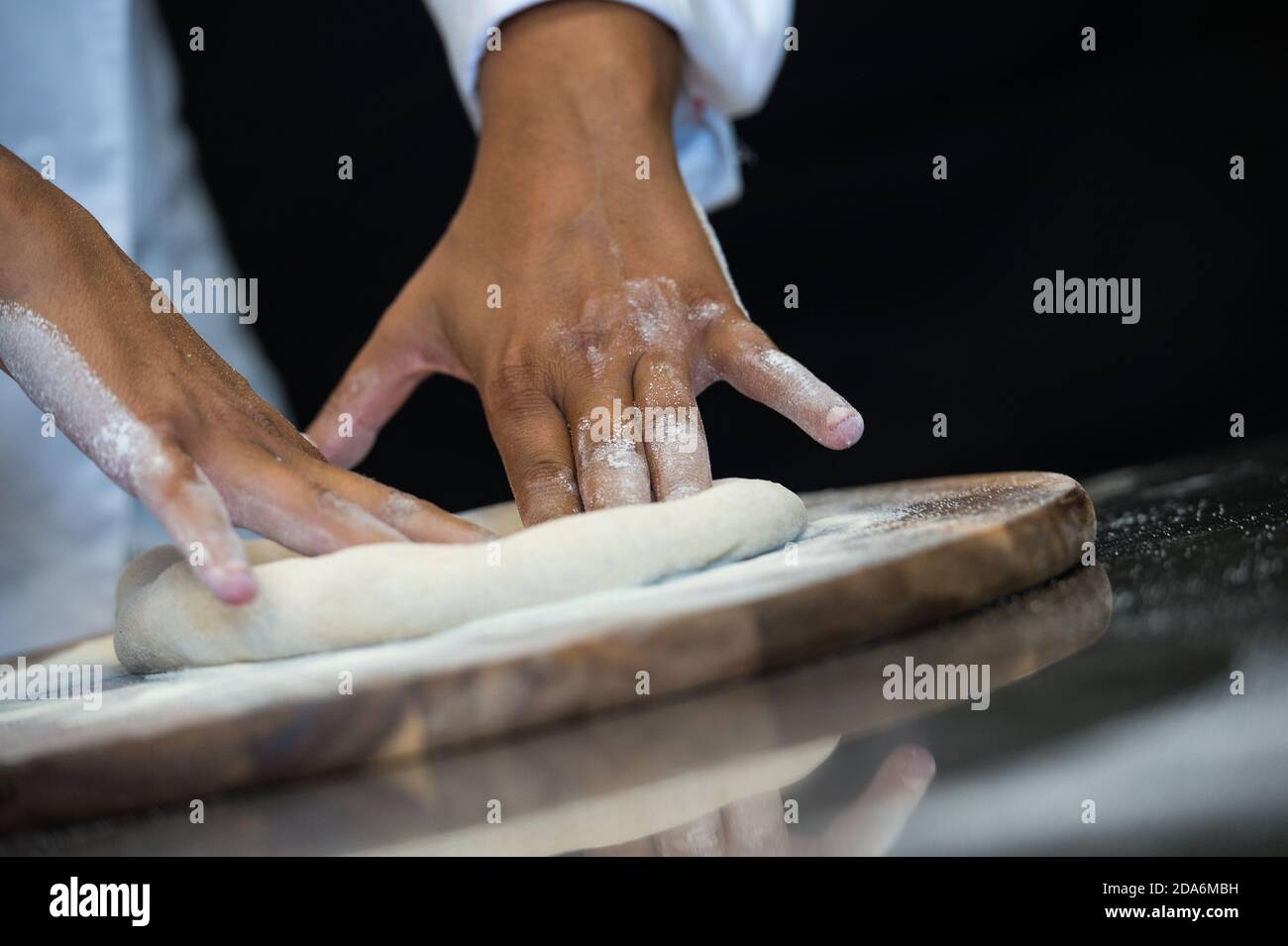 detail of the hands of a pizza chef chef who works for the various ...