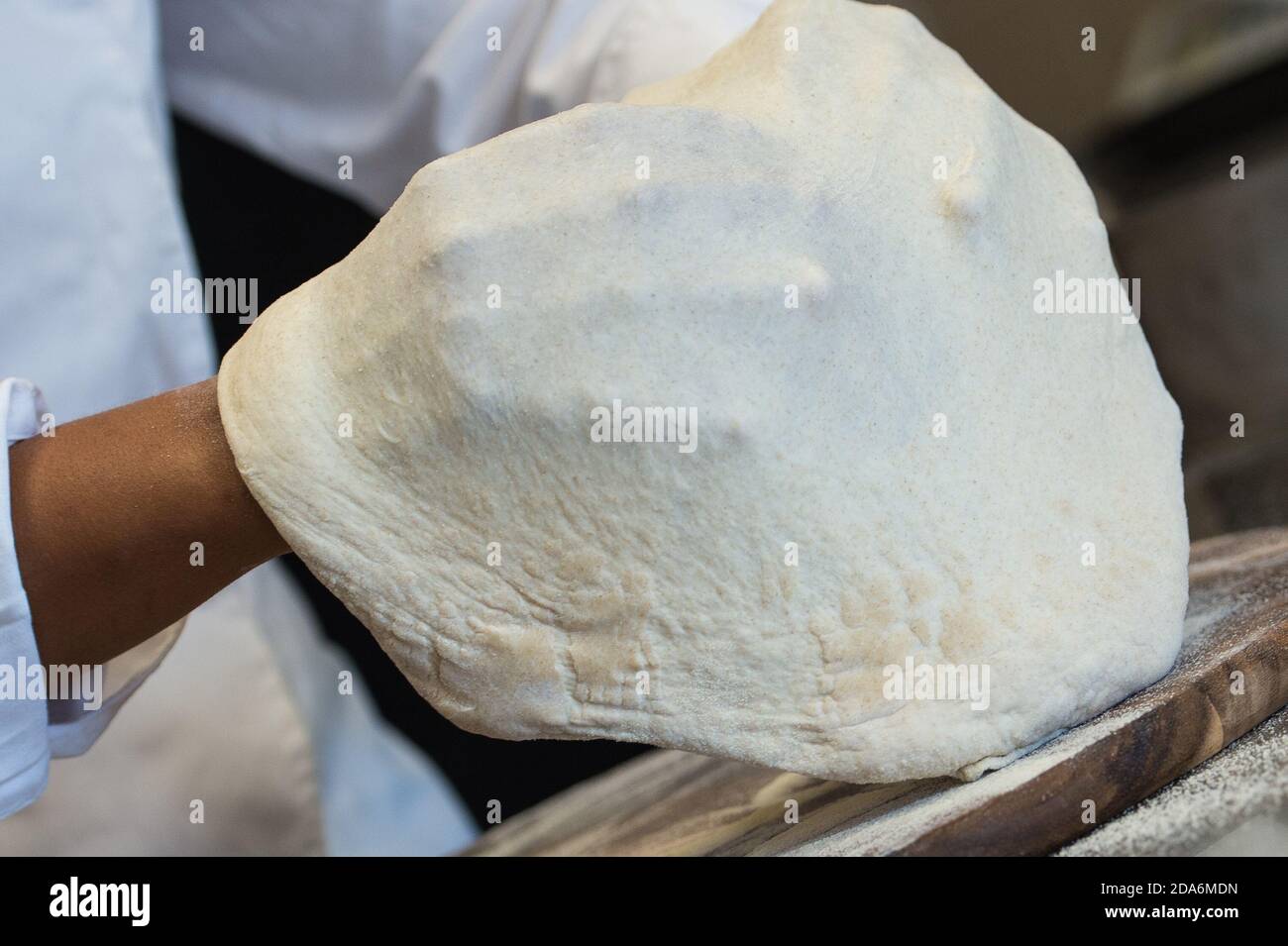 detail of the hands of a pizza chef chef who works for the various ...