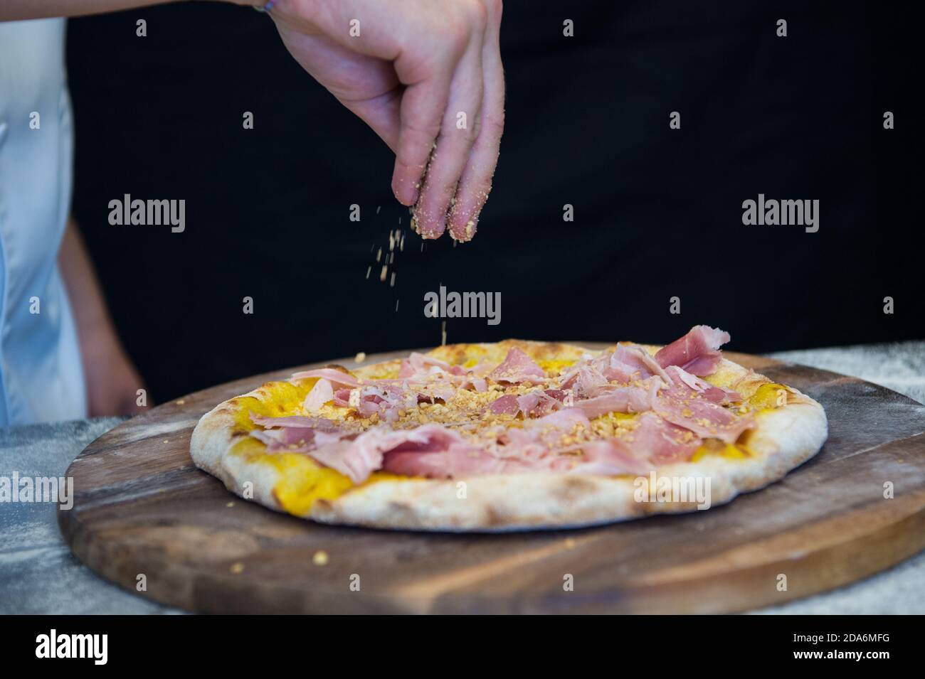 detail of the hands of a pizza chef chef who works for the various ...