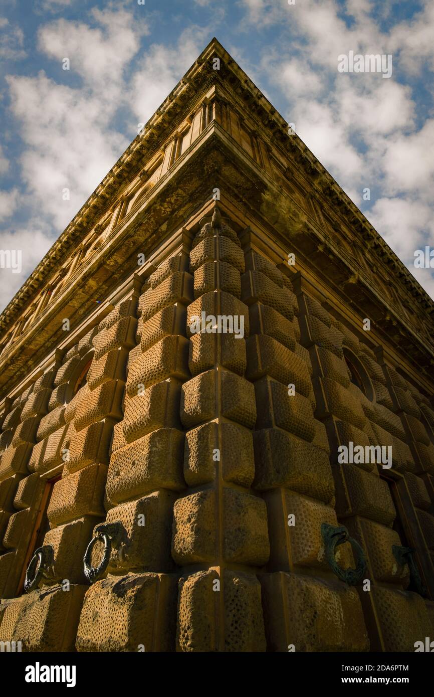 Vertical shot of a tall angular stone building Stock Photo - Alamy