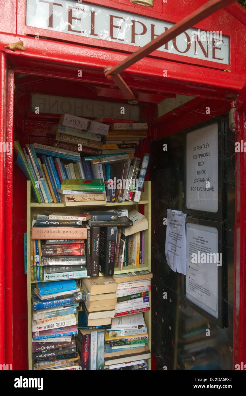 Repurposing a telephone booth as a book exchange and notice board ...