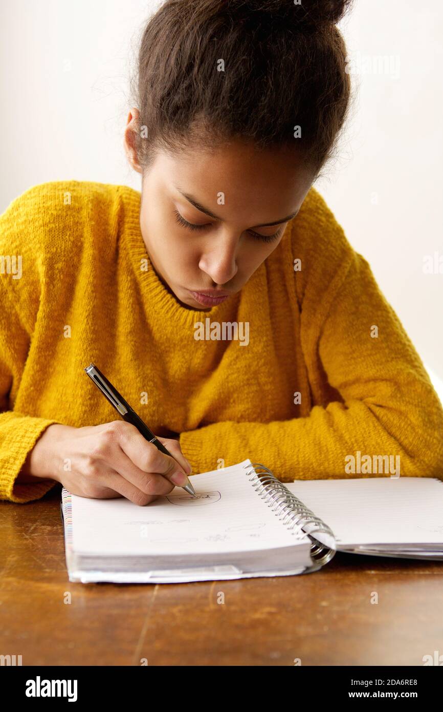 Student writing in book hi-res stock photography and images - Alamy