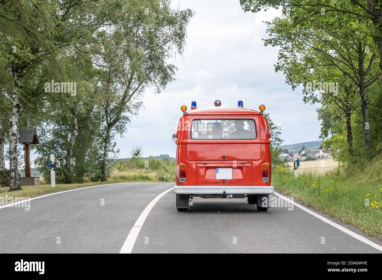 VW T1 fire engine red firefigther car Oldtimer classic car drivin on ...
