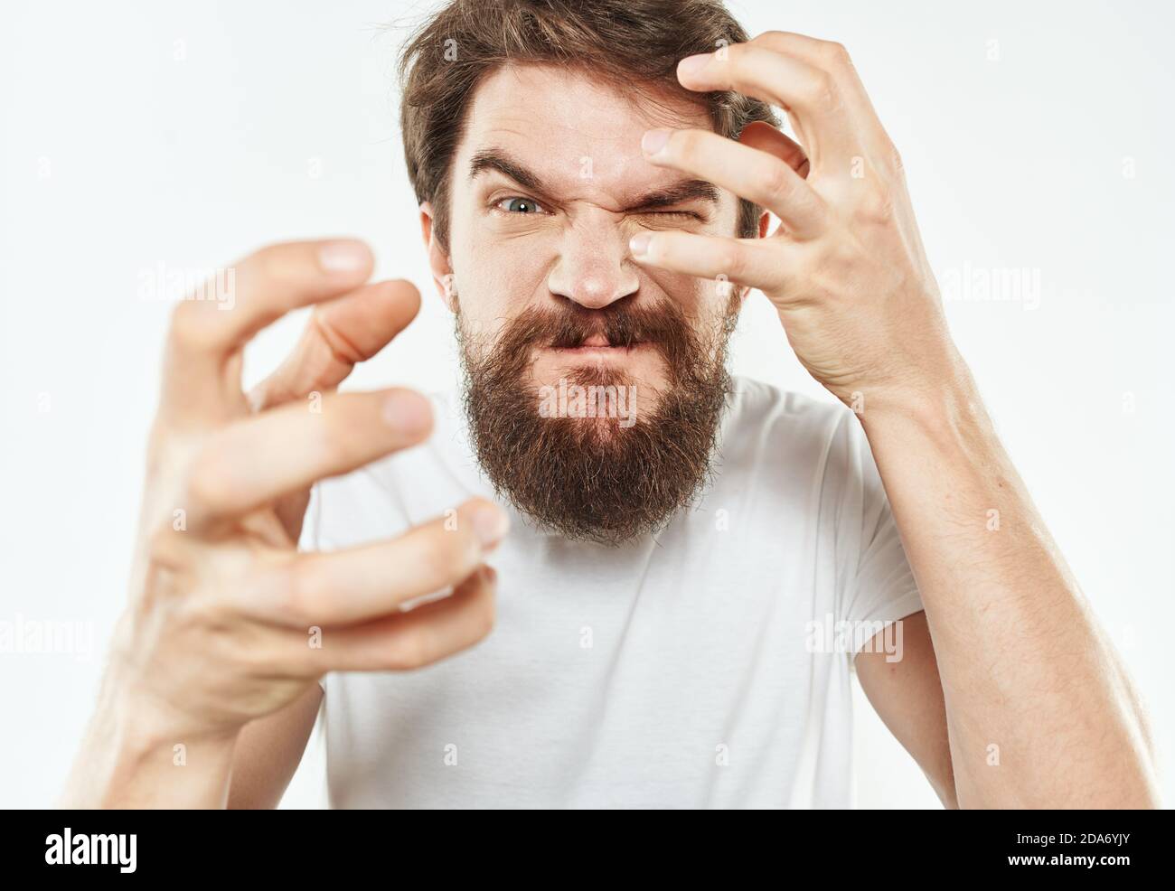 Aggressive man irritability emotions gesturing with model hands Stock ...