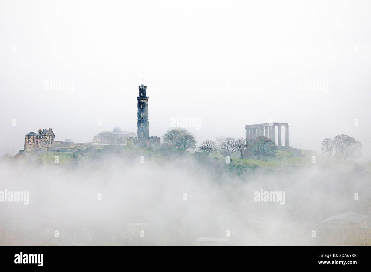 Mist surrounds the Nelson Monument and the National Monument on Calton ...
