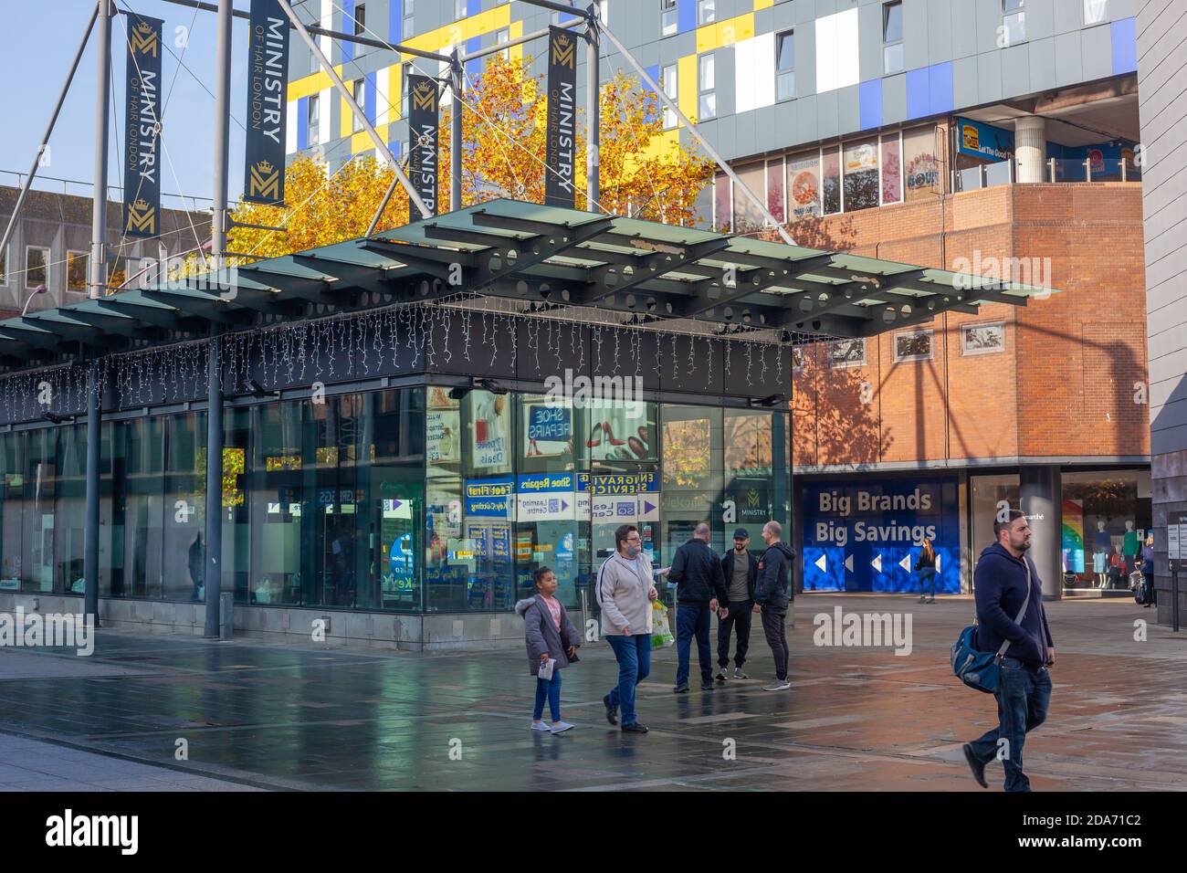 View of several people of mixed ages walking in Basildon Town Centre ...