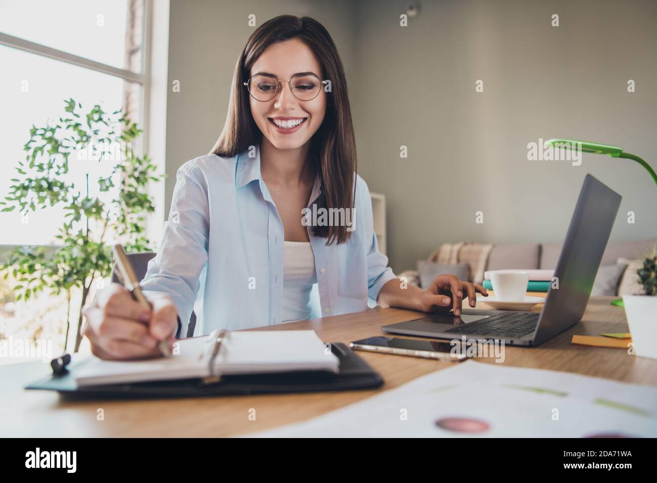 Photo of charming business lady pen write notebook toothy smile use ...