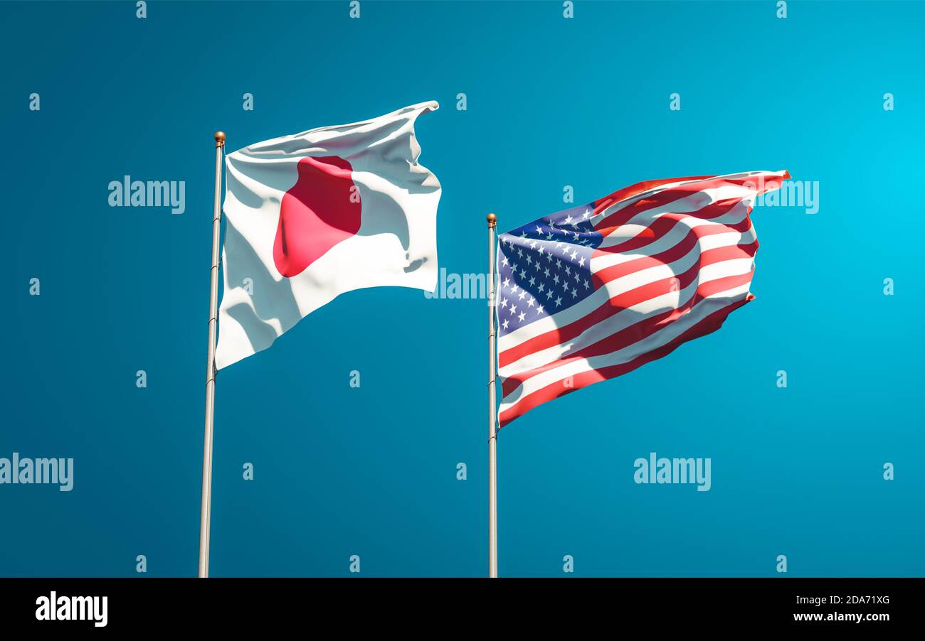 Beautiful national state flags of Japan and USA together at the sky ...