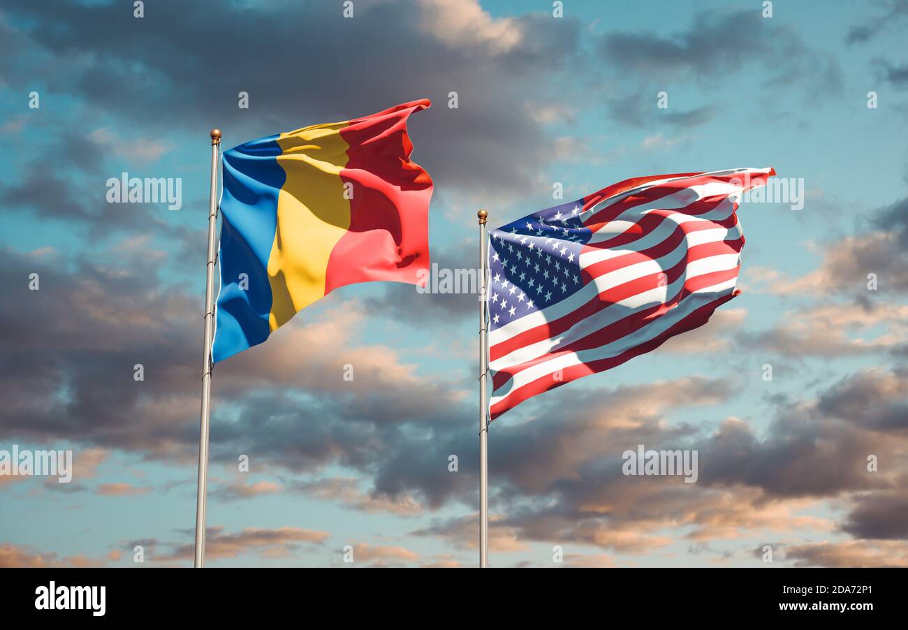Beautiful national state flags of Romania and USA together at the sky ...