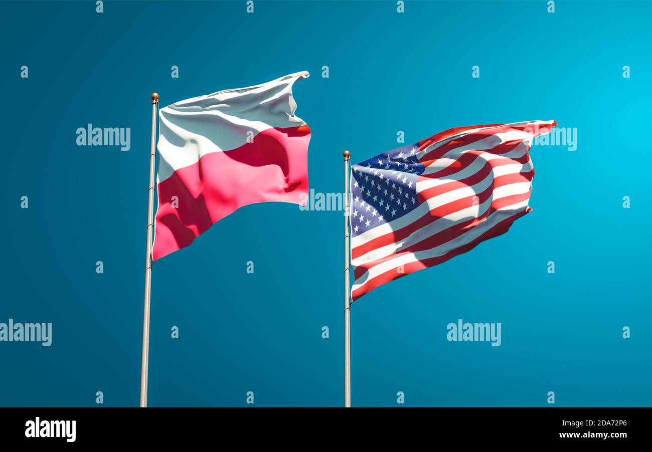 Beautiful national state flags of Poland and USA together at the sky ...