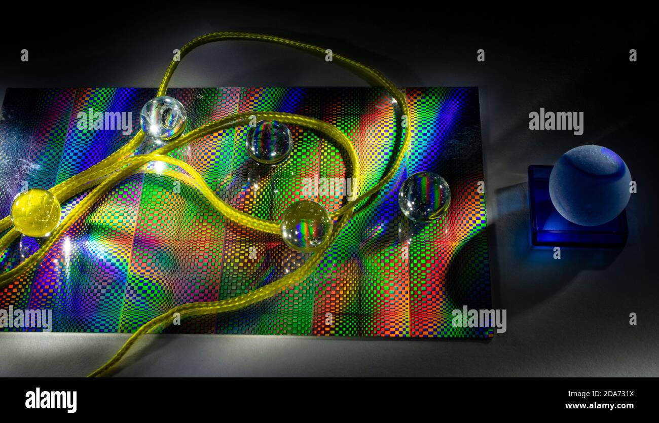 Marbles + Yellow String Stock Photo - Alamy