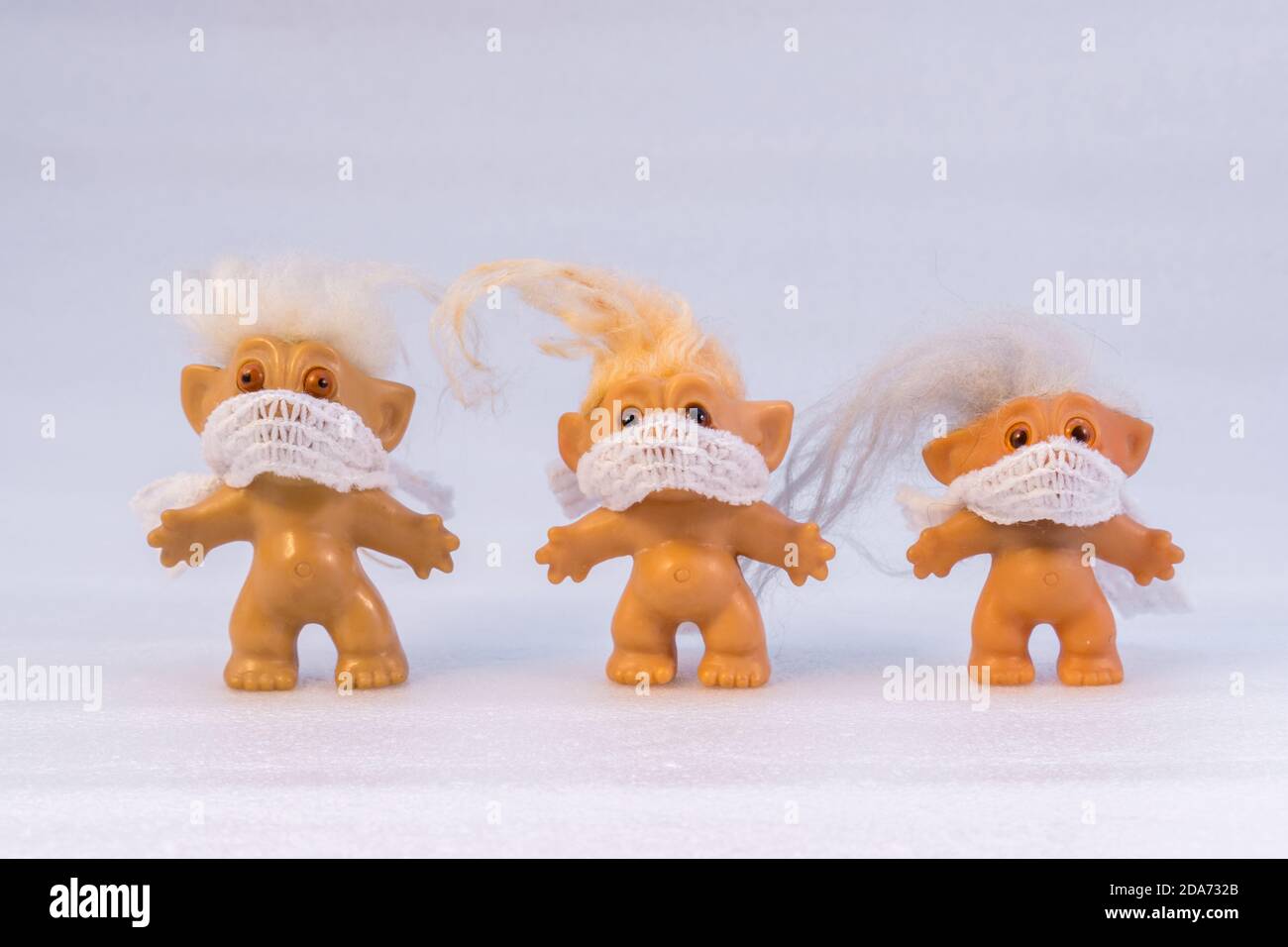 Three trolls wearing masks Stock Photo - Alamy