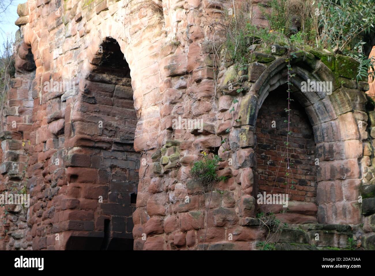 Red brick walls and archway of the ruins of St Johns Church in Chester ...