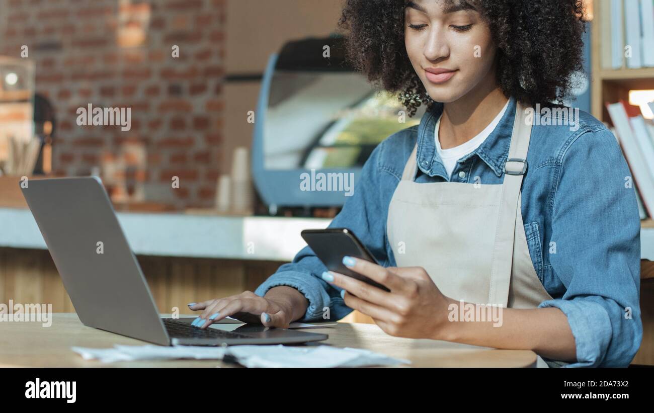 Owner of coffee business works in accounting with social media Stock ...