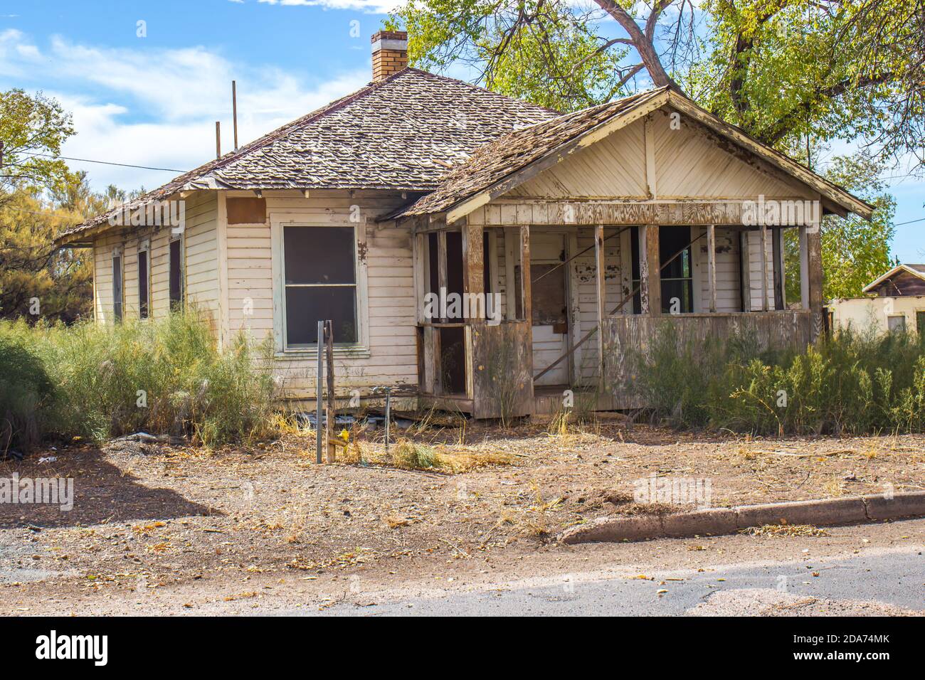 Abandoned One Story Home In Disrepair & Overgrown Stock Photo - Alamy